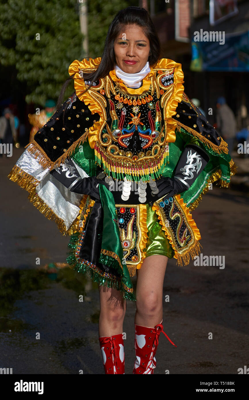Diablada dancers in ornate costumes prepare to parade through the ...