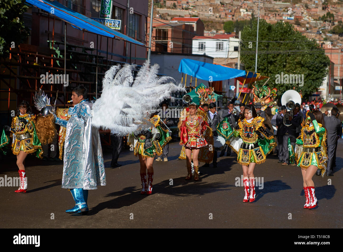 Diablada dancers in ornate costumes prepare to parade through the ...