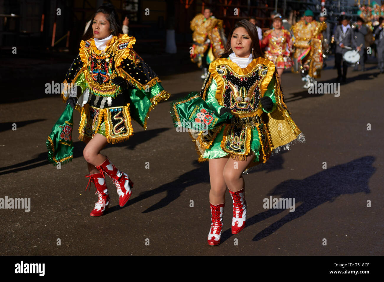 Diablada dancers in ornate costumes prepare to parade through the ...