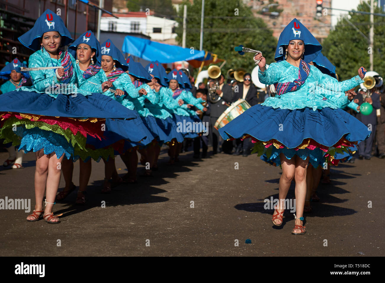 Llamerada dancers in ornate costumes performing as they parade through ...