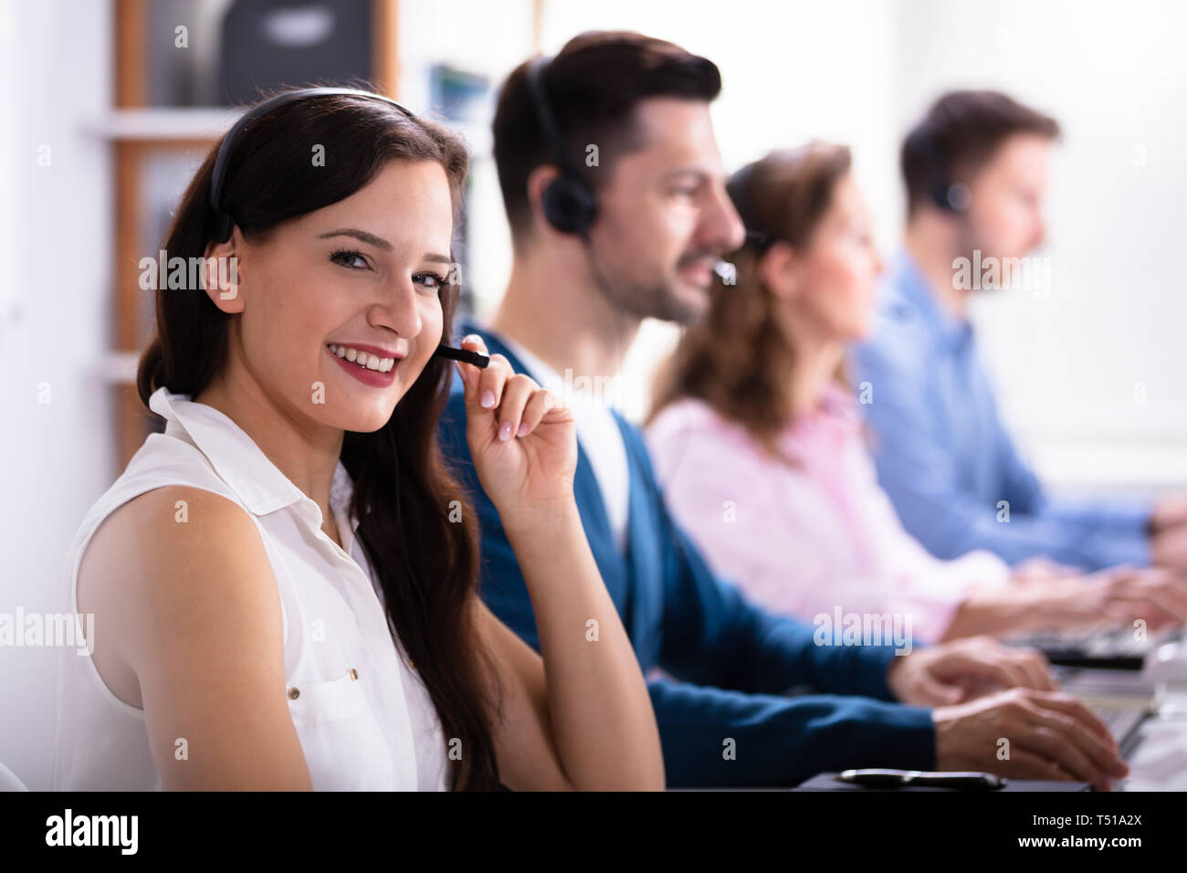 Portrait Of A Happy Young Female Customer Service Executive Stock Photo ...