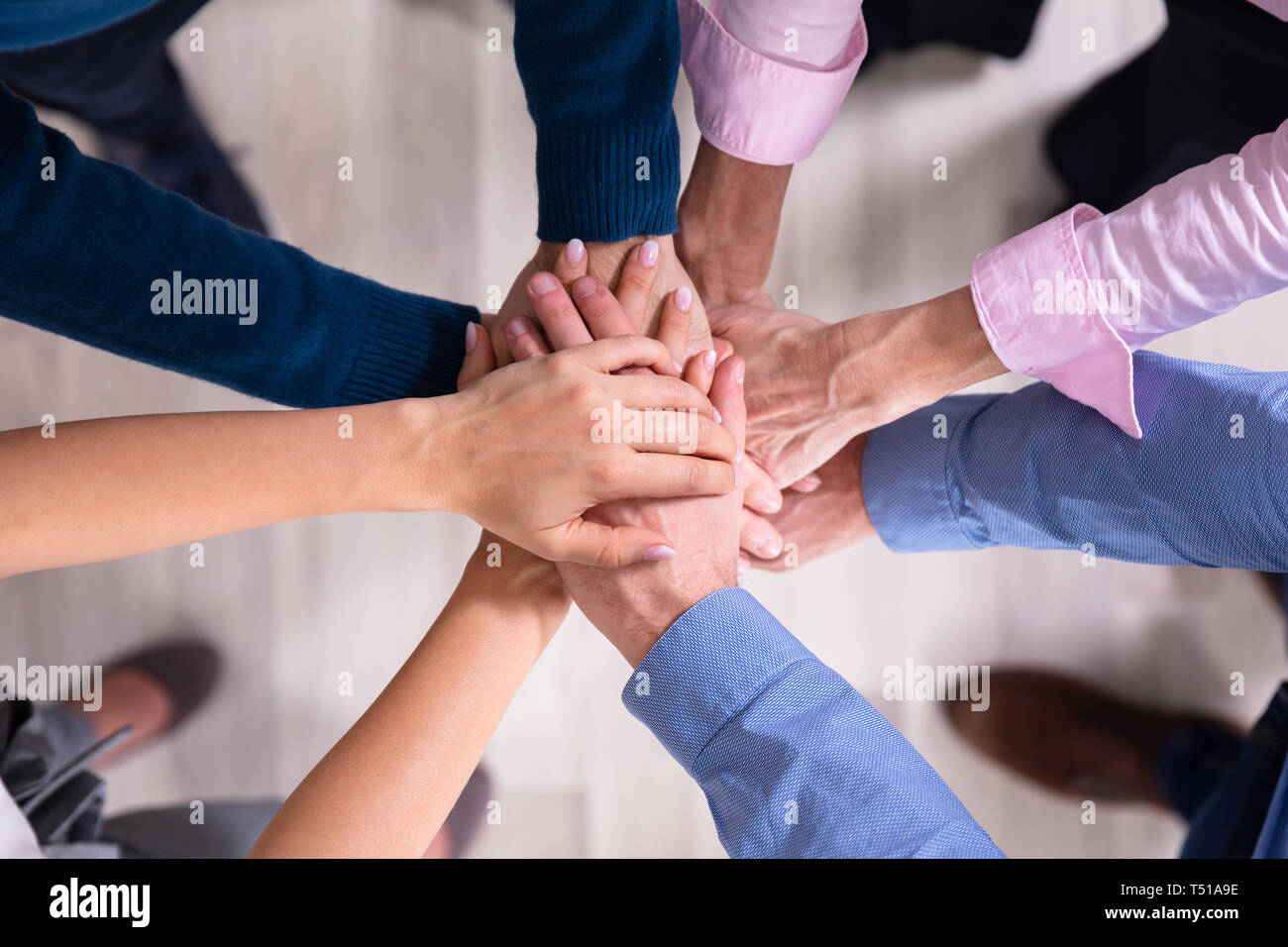 An Elevated View Of Businesspeople Stacking Hands Over Each Other Stock ...