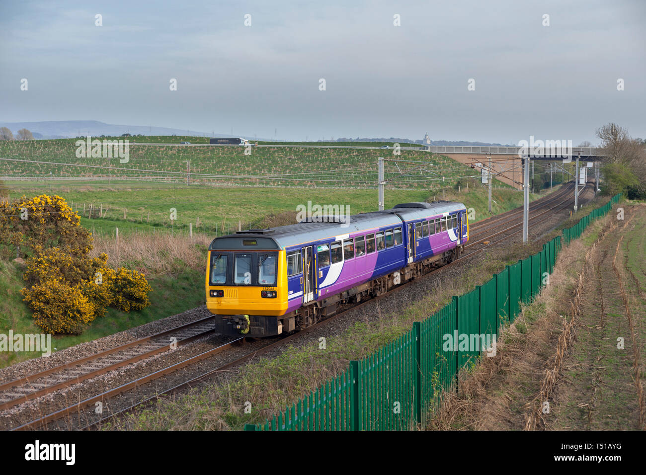 A Arriva Northern Rail class 142 pacer on the west coast main line with ...