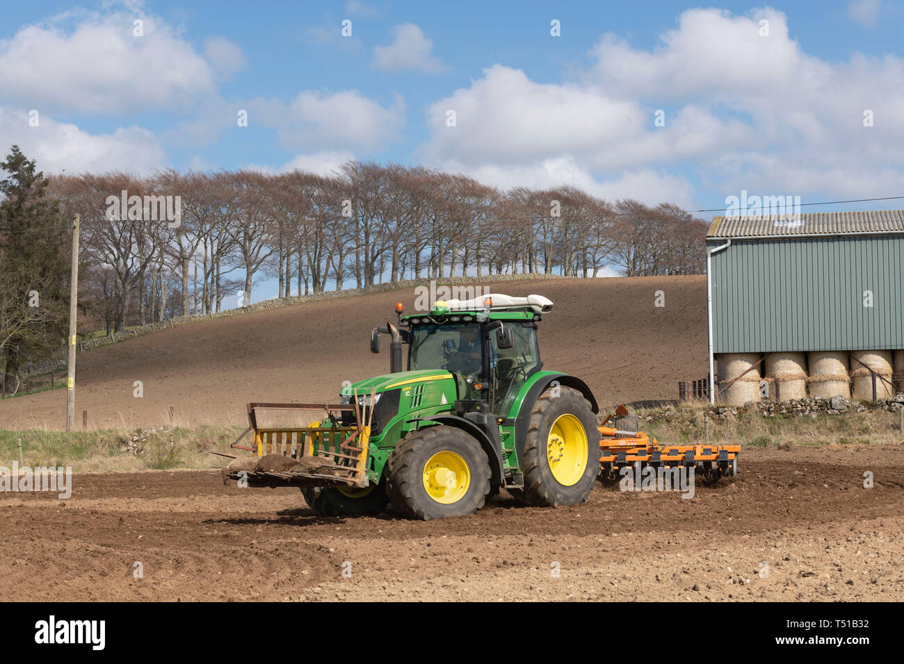 A Green John Deere Tractor and a Simba Unipress Cultivator at Work in ...