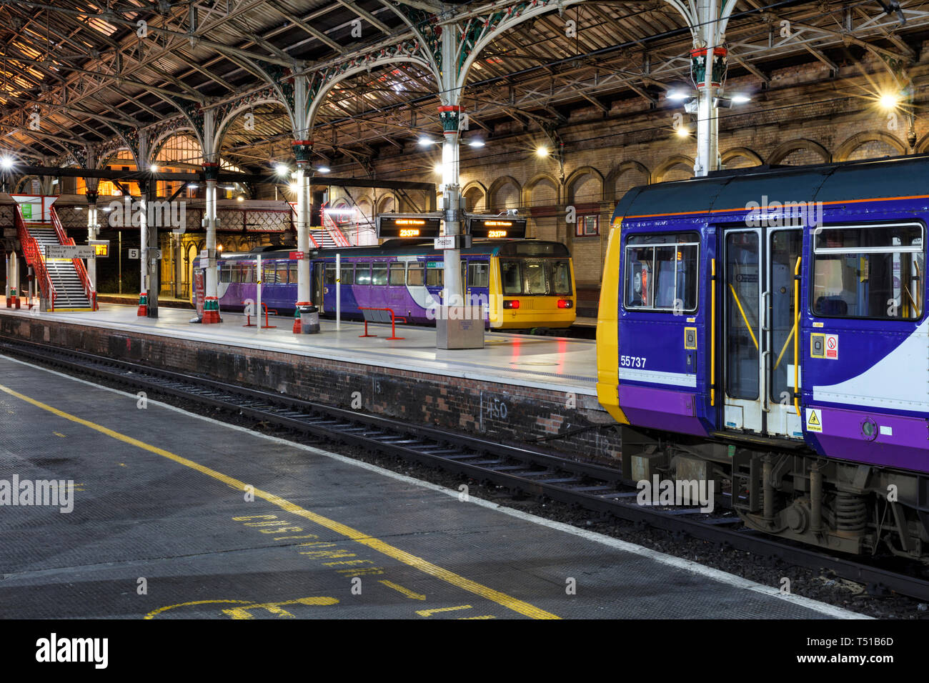 2 Northern Rail class 142 pacer trains at Preston station late at night ...