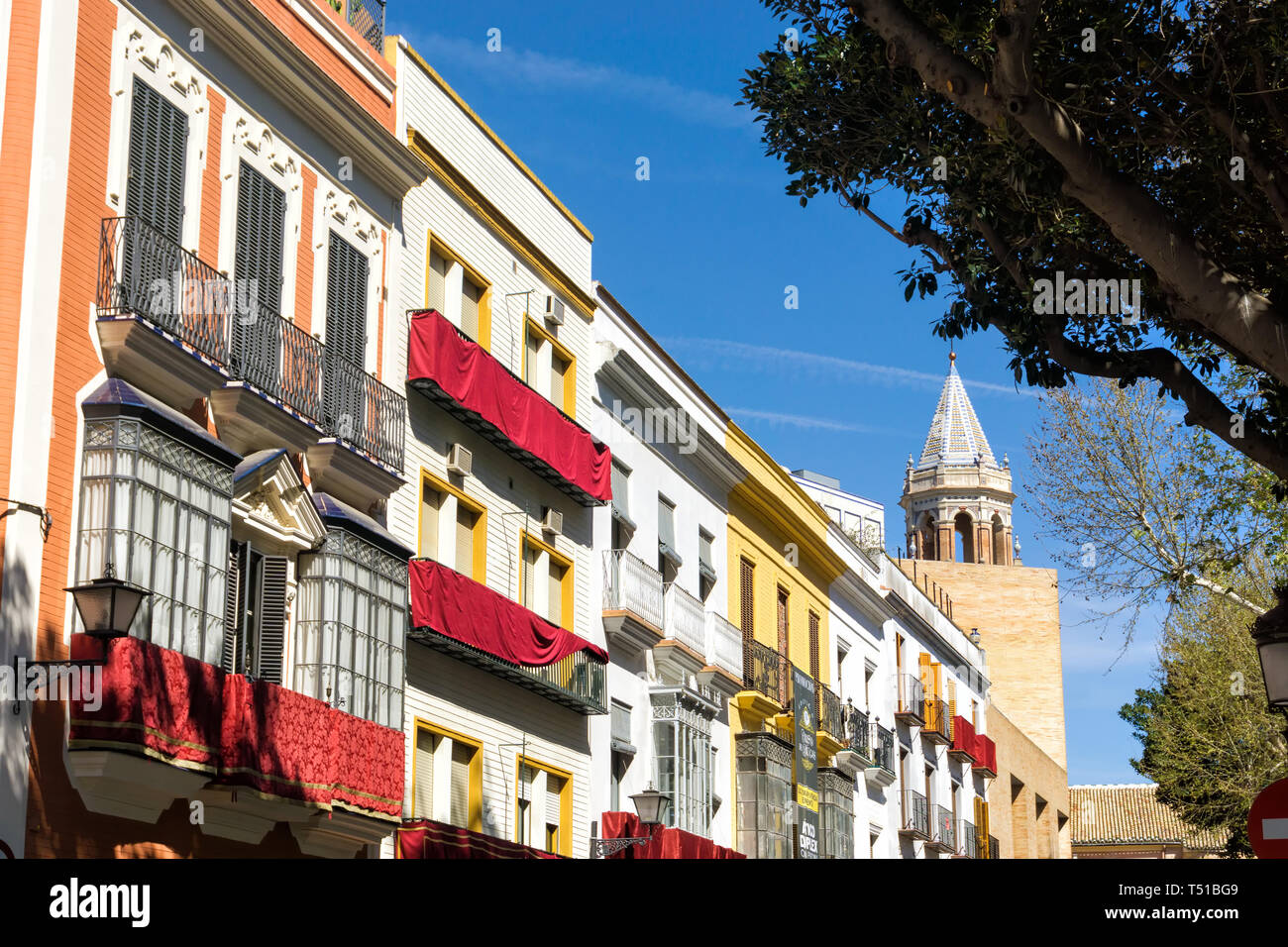 Colorful buildings with church spire view in Seville, Spain Stock Photo ...