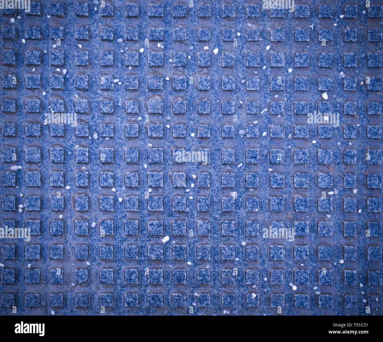 blue squared tile for blind pedestrians on the sidewalk with vignette ...