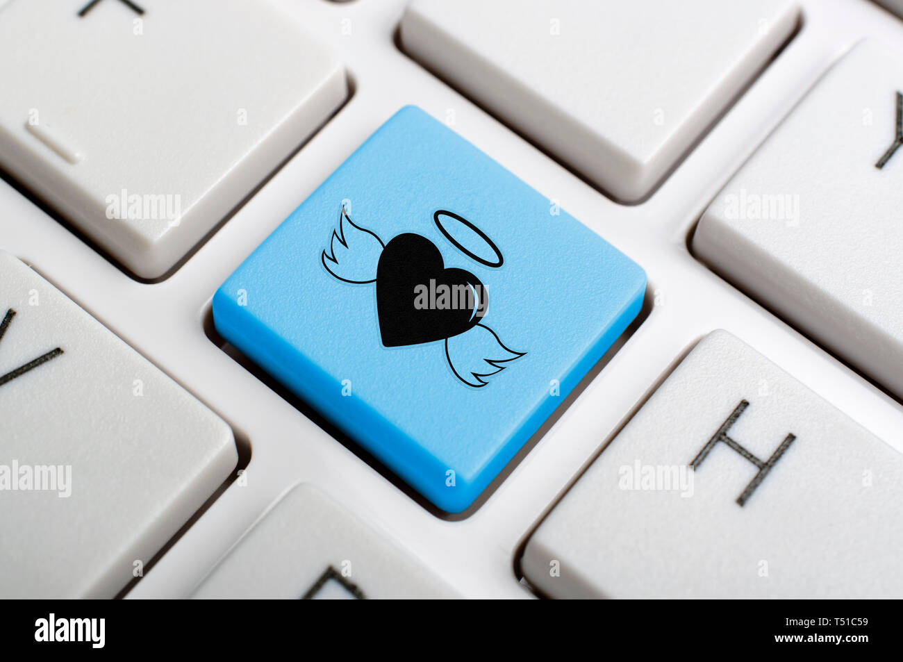 Blue angel key on keyboard Stock Photo - Alamy