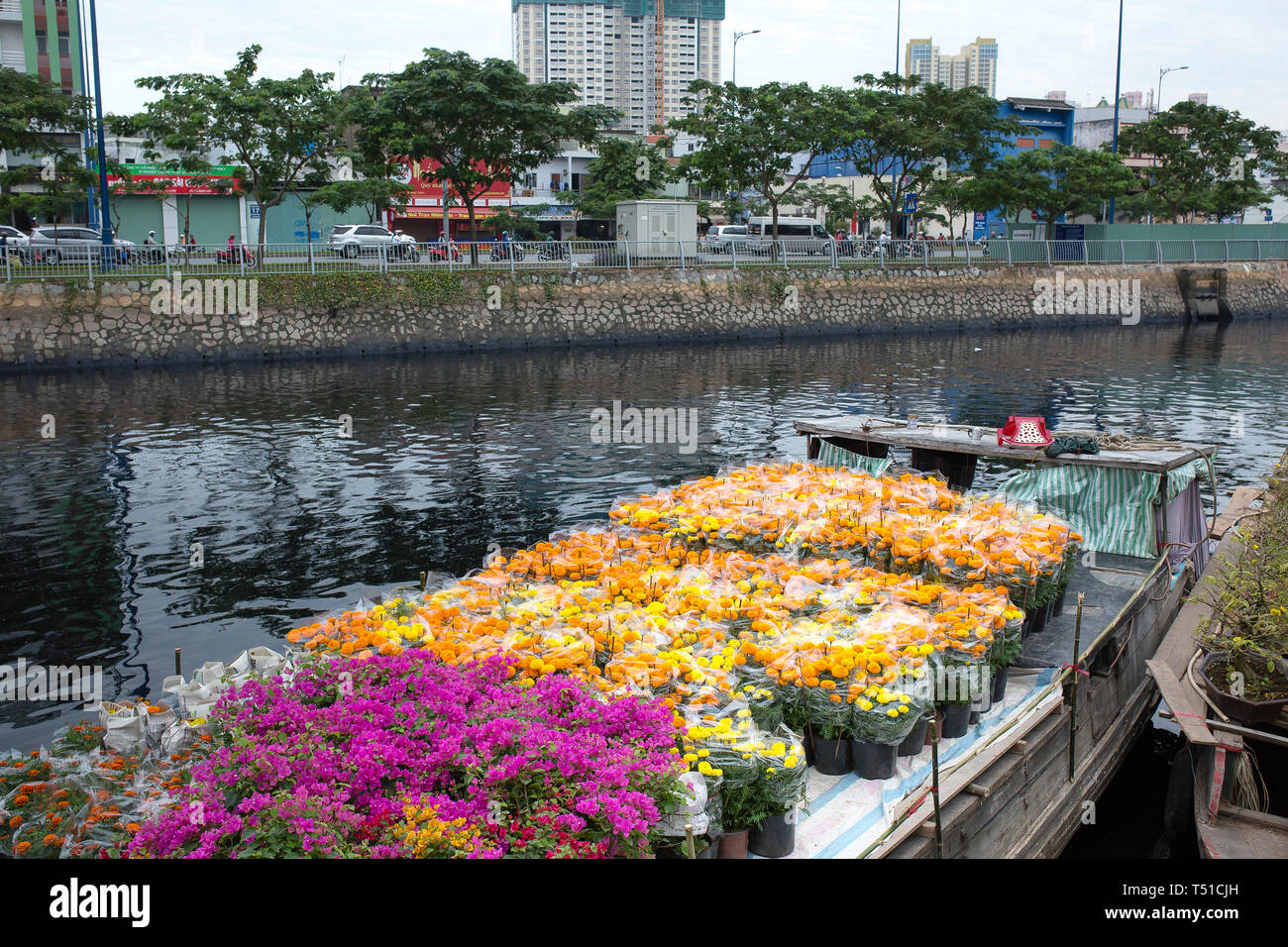 Flowers on ships at Saigon flower market at Tet in Vietnam Stock Photo ...