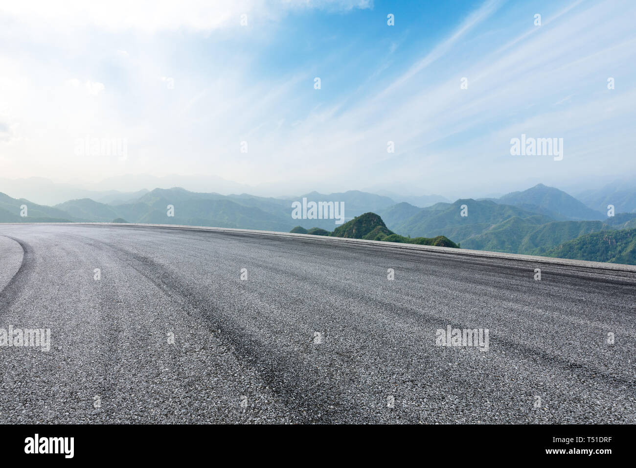Asphalt race track ground and mountain with clouds background Stock ...