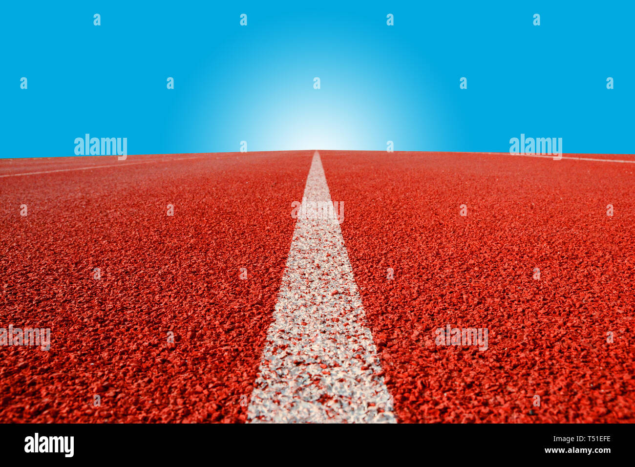 Running track with lanes over sky and clouds Stock Photo - Alamy