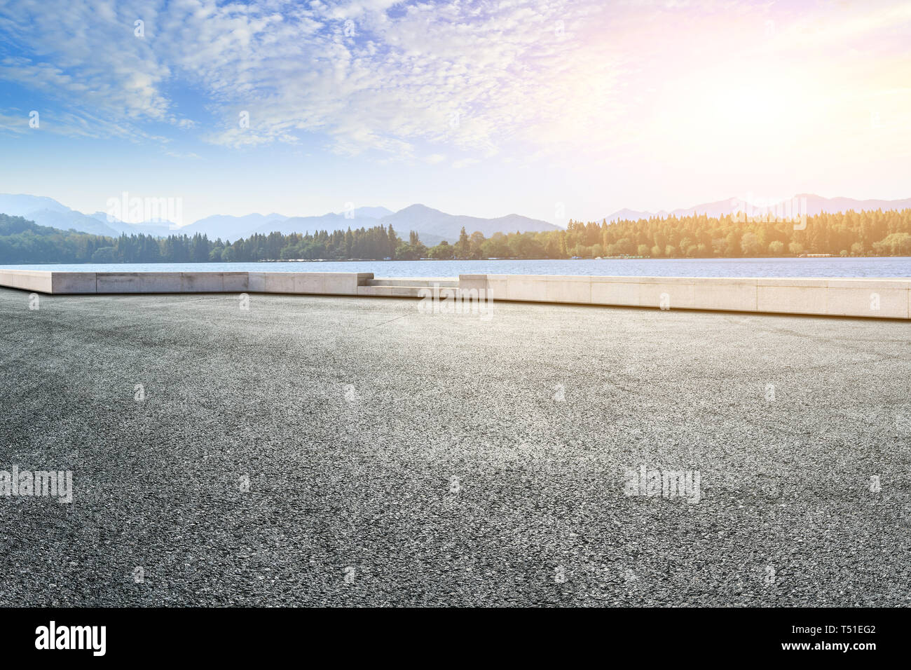 Empty asphalt road and mountains with lake landscape Stock Photo - Alamy