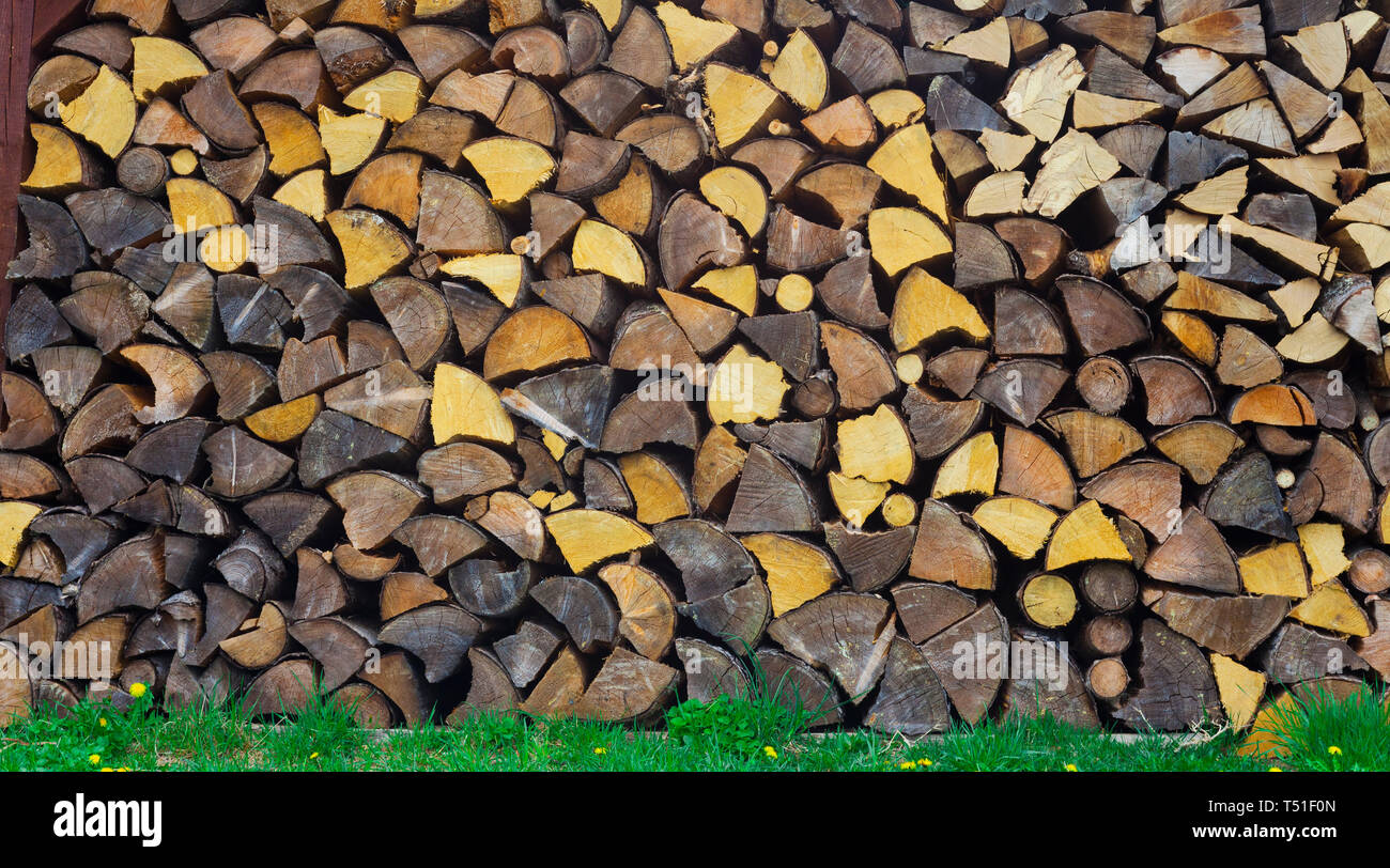 stack or pile of cut wood in the garden Stock Photo - Alamy