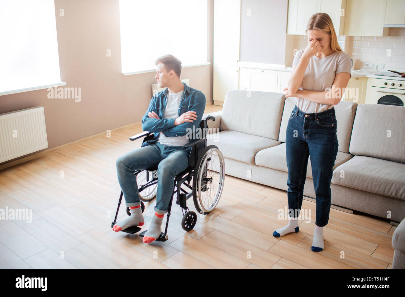 Upset young man with disability on wheelchair. Person with psecial ...