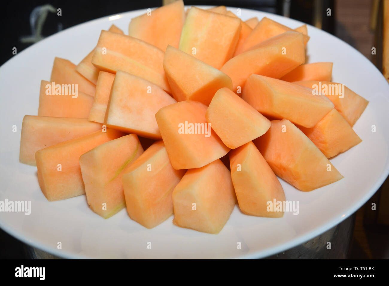 Melon slice on plate Stock Photo - Alamy