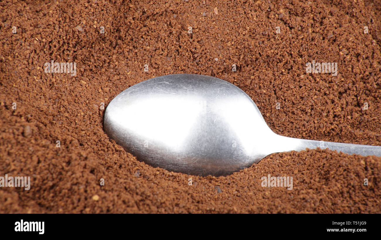 milled coffee and one teaspoon Stock Photo - Alamy