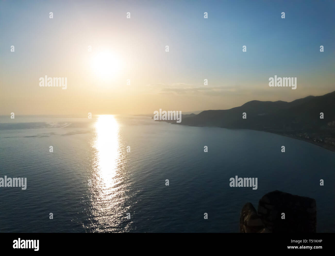 Sunset at the calm sea coast with mountains, wallpaper or background ...