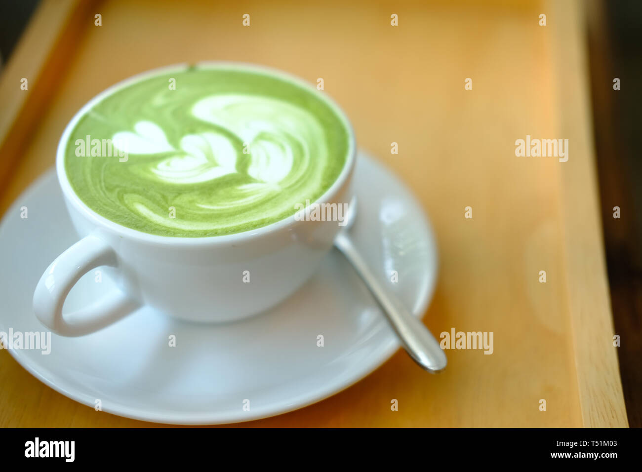 hot matcha green tea latte on wood table. delicious beverage Stock ...