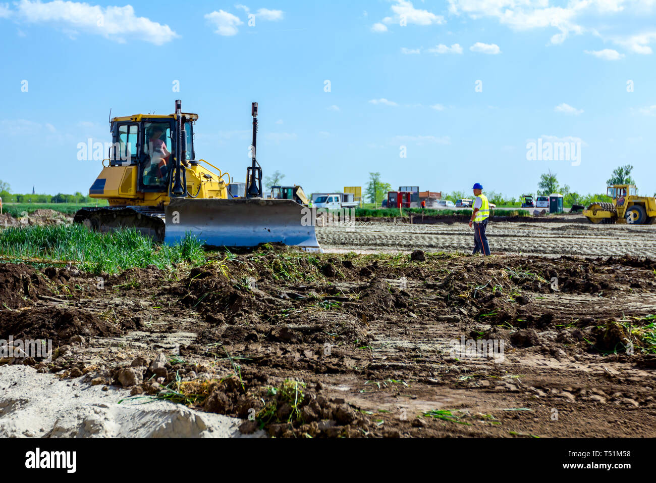 Bulldozer is pushing ground, leveling, equates building site Stock ...