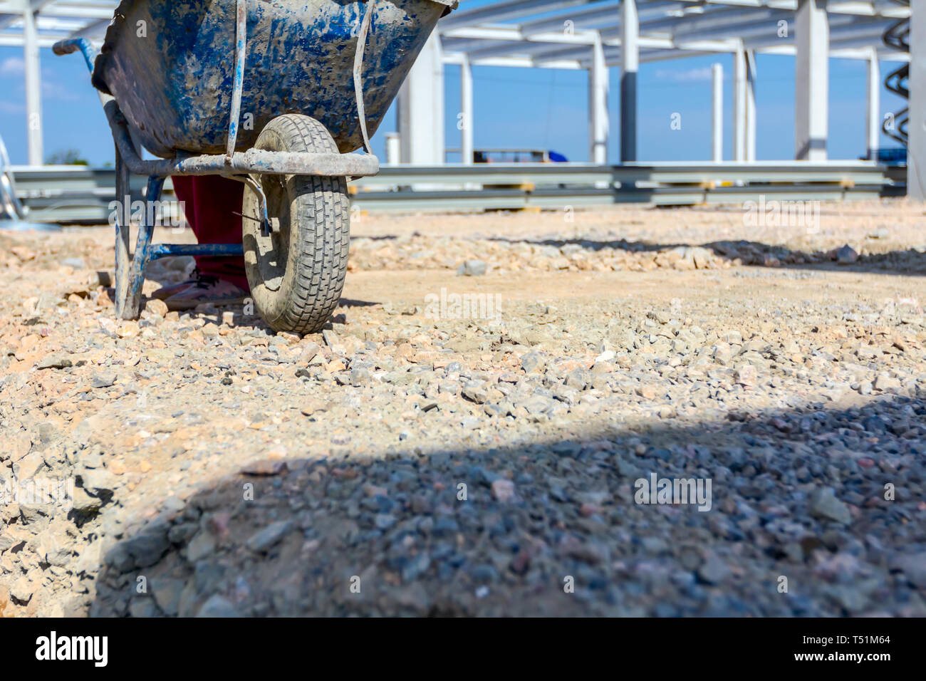 View of front side on used wheelbarrow at construction site Stock Photo ...