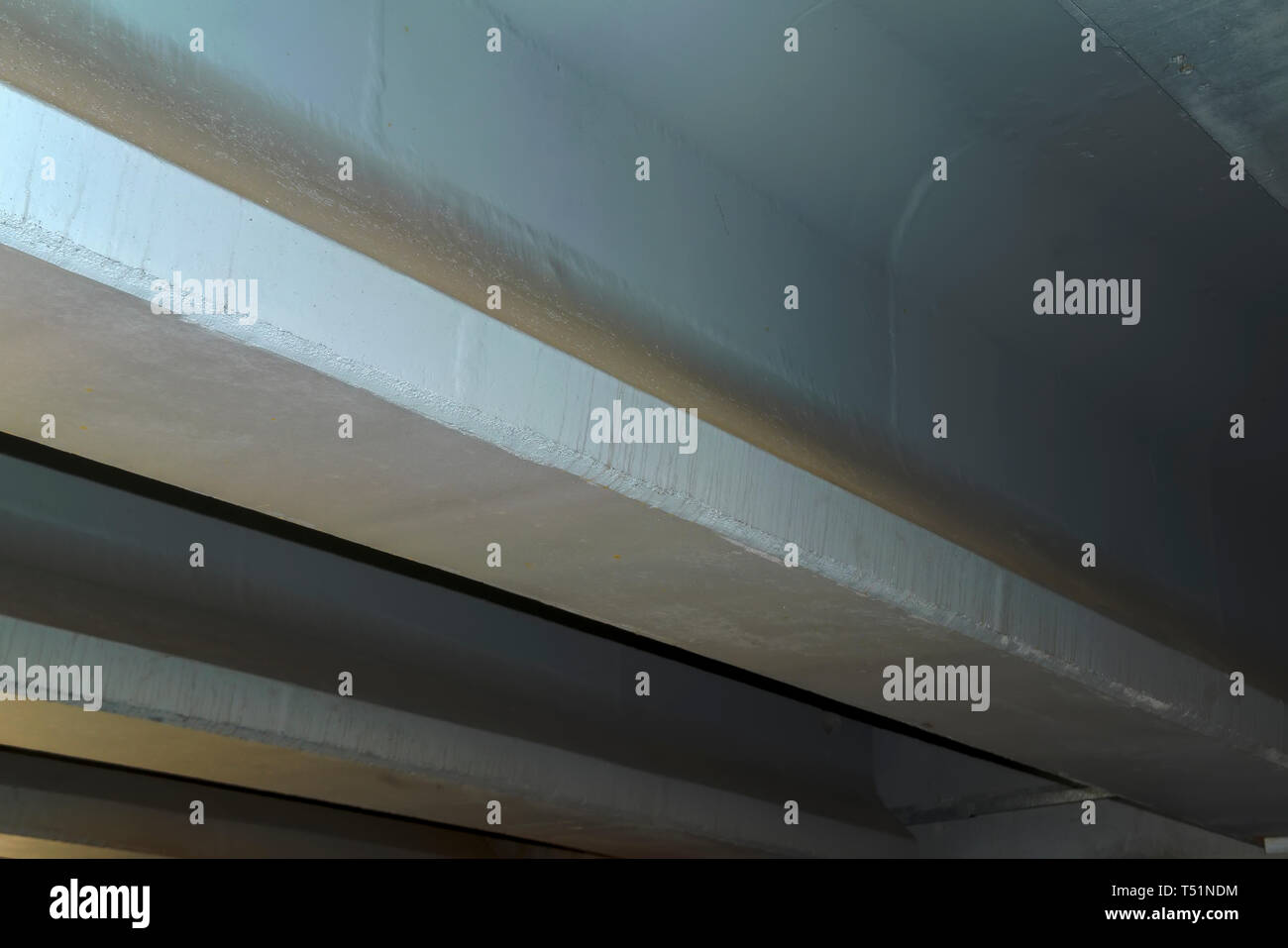 Bottom view of the large concrete highway bridge across the river Stock ...