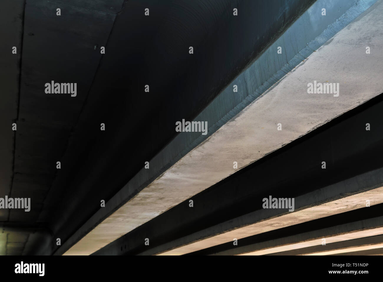 Bottom view of the large concrete highway bridge across the river Stock ...