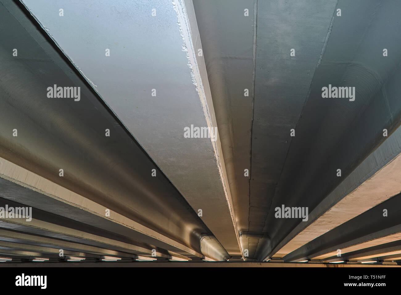 Bottom view of the large concrete highway bridge across the river Stock ...