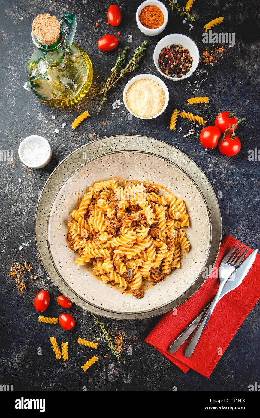 Pasta fusilli with bolognese tomato beef sauce. Traditional italian ...