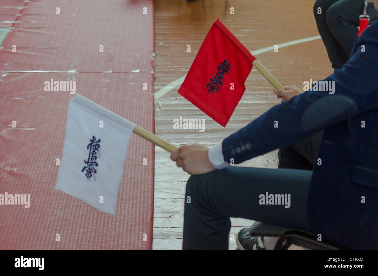 The red and white flags of the judge in the competitions in the aerial ...