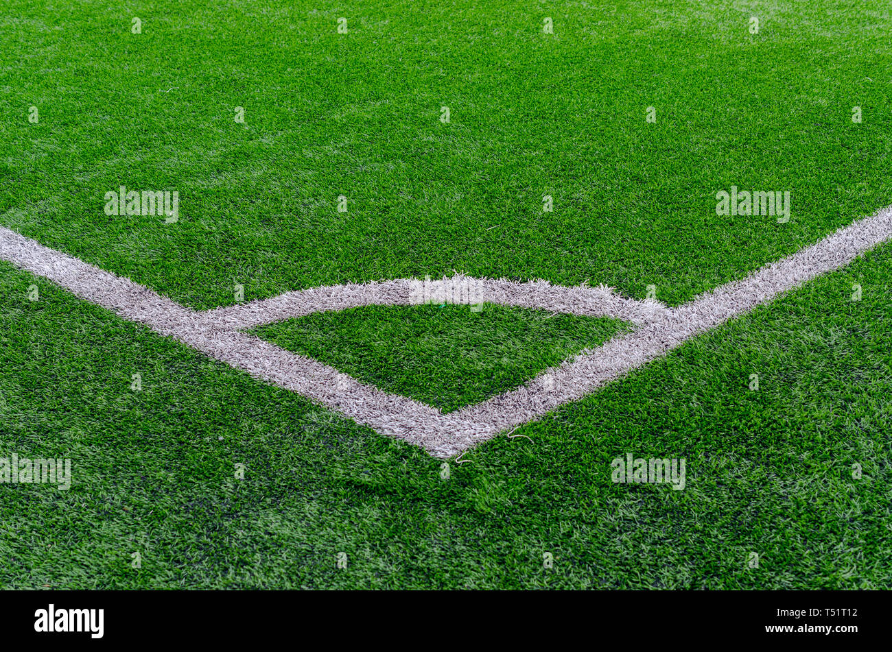 White marking corner on a bright green football field Stock Photo - Alamy