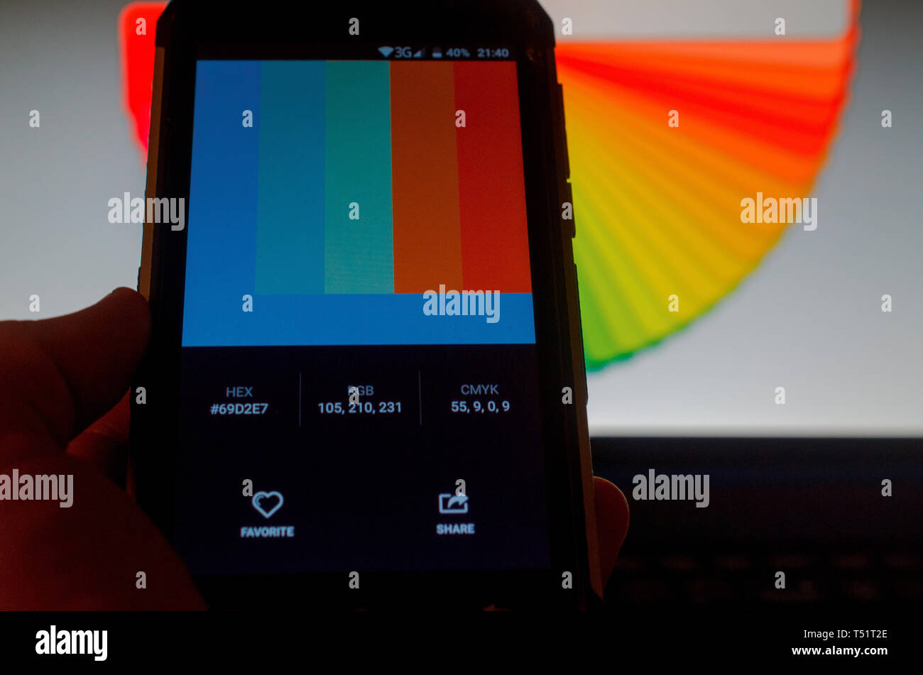 Electronic color palettes between a smartphone and a laptop Stock Photo ...