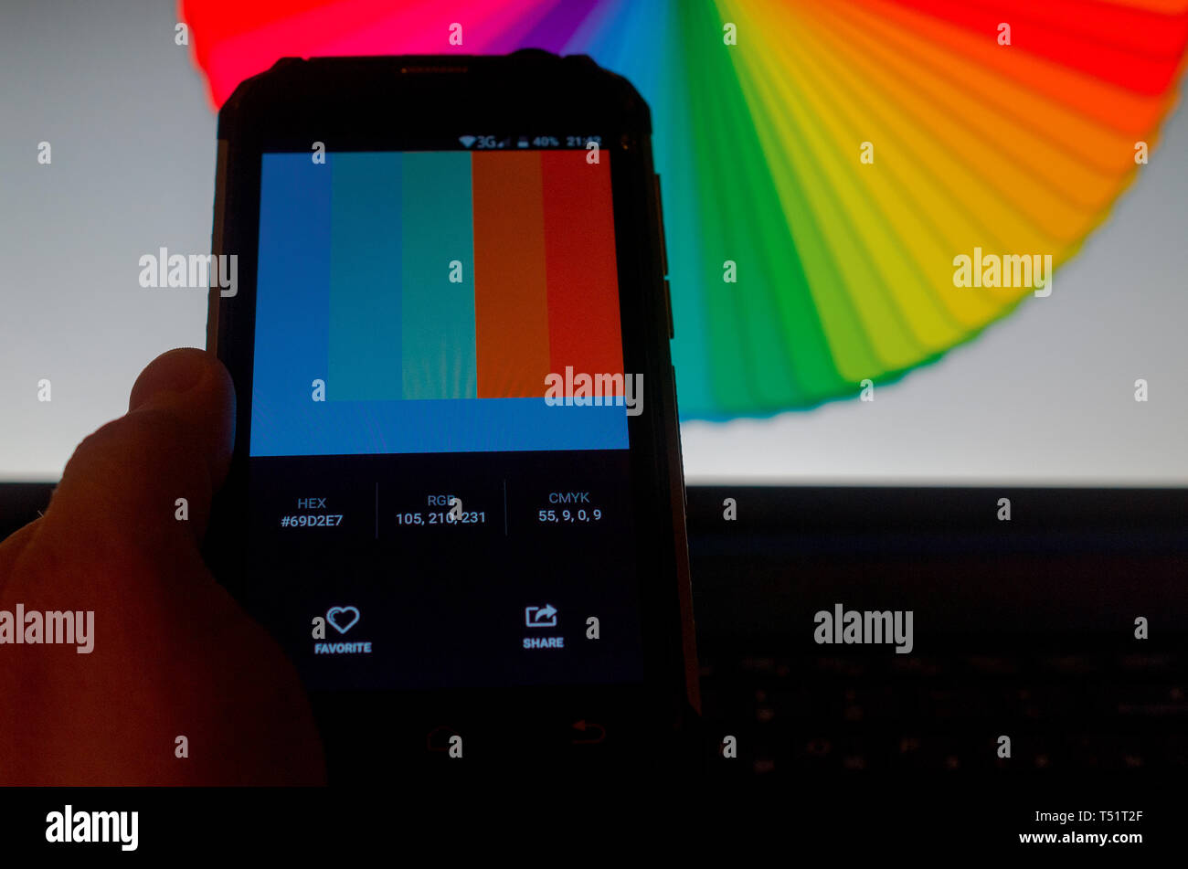 Electronic color palettes between a smartphone and a laptop Stock Photo ...