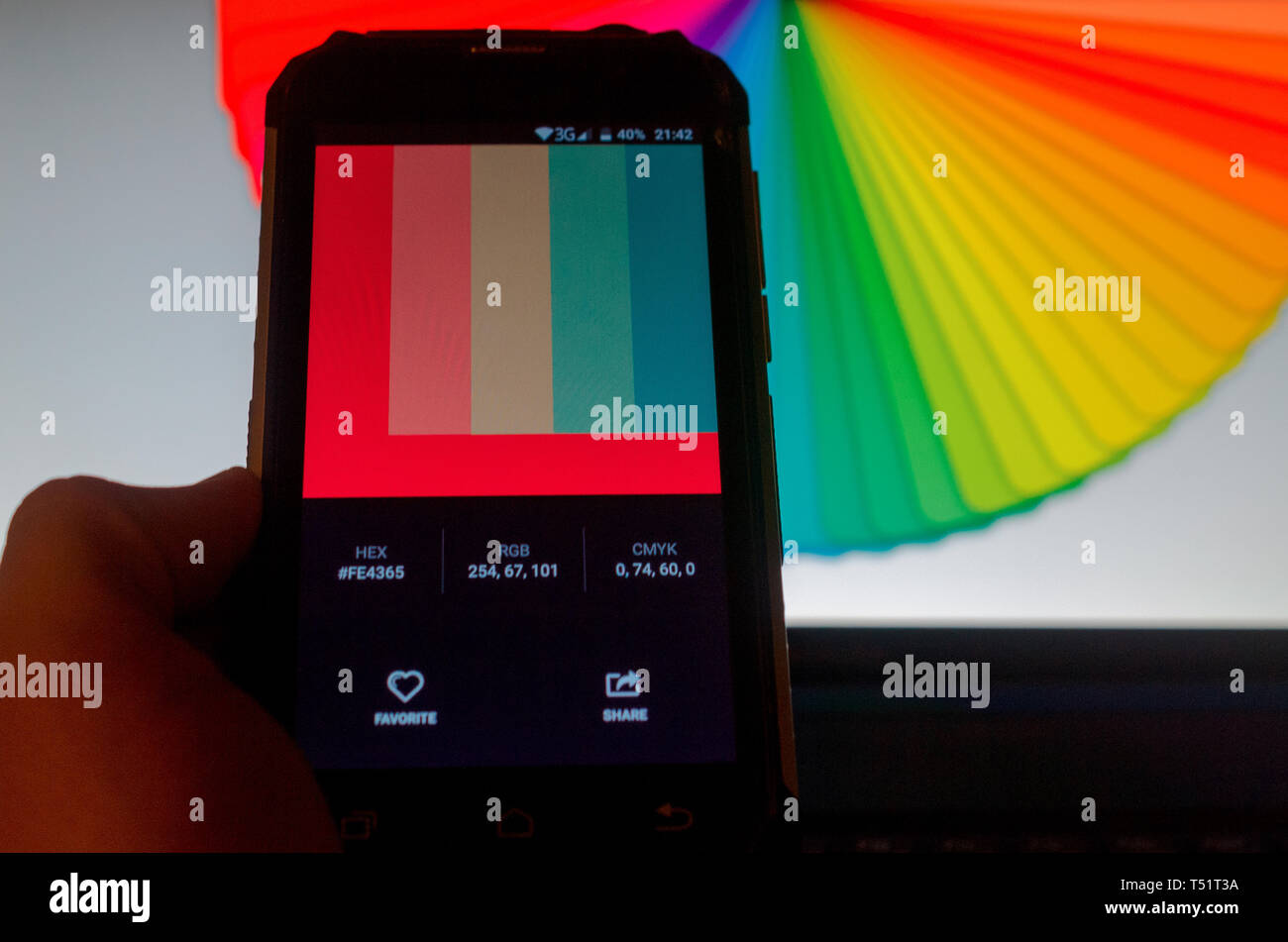 Electronic color palettes between a smartphone and a laptop Stock Photo ...