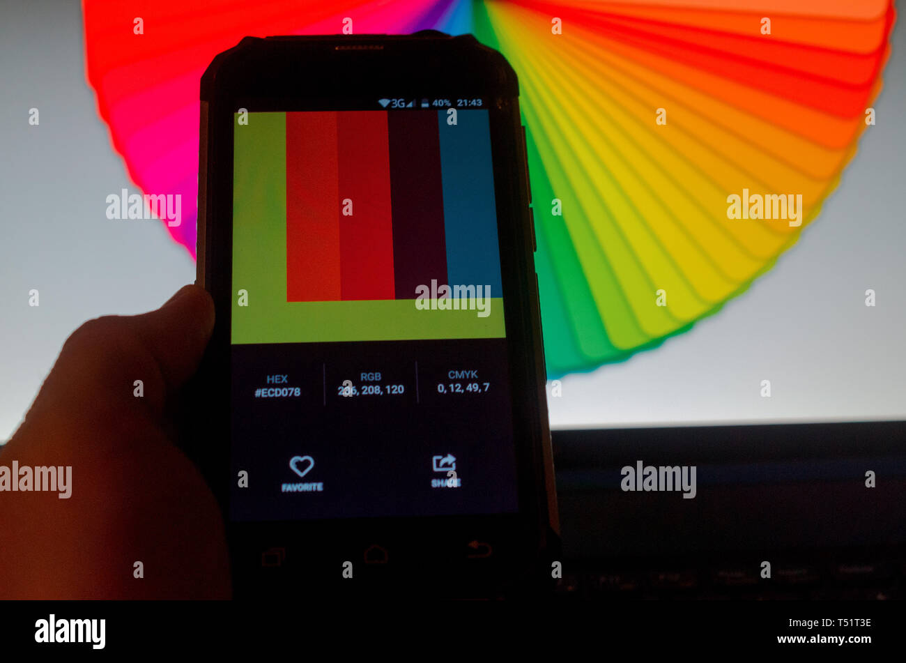 Electronic color palettes between a smartphone and a laptop Stock Photo ...