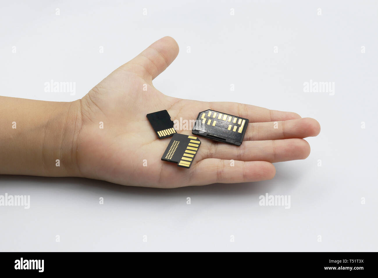 Memory card in kids hand isolated on white background Stock Photo - Alamy