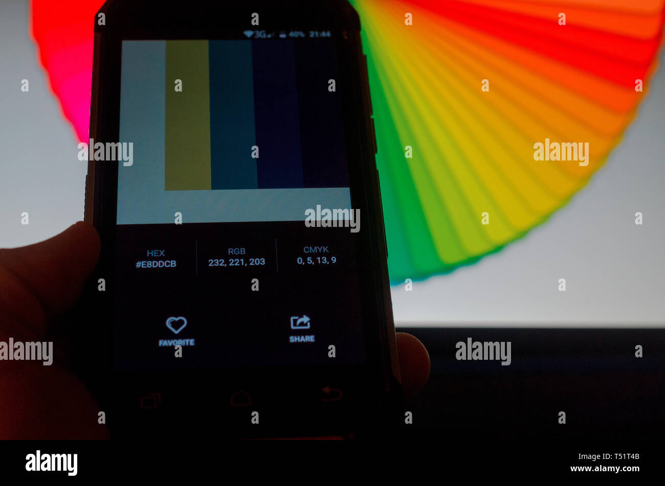 Electronic color palettes between a smartphone and a laptop Stock Photo ...