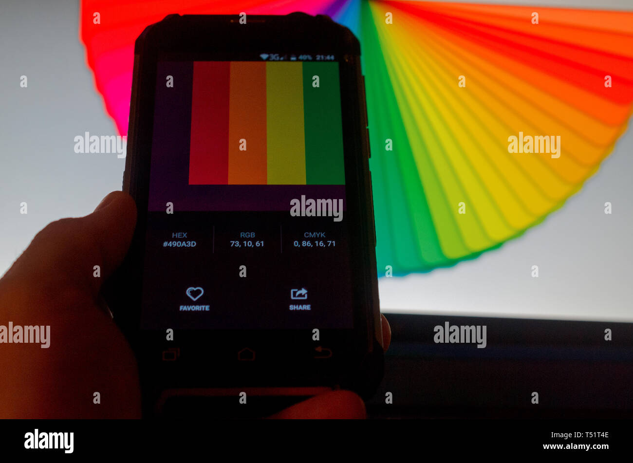 Electronic color palettes between a smartphone and a laptop Stock Photo ...