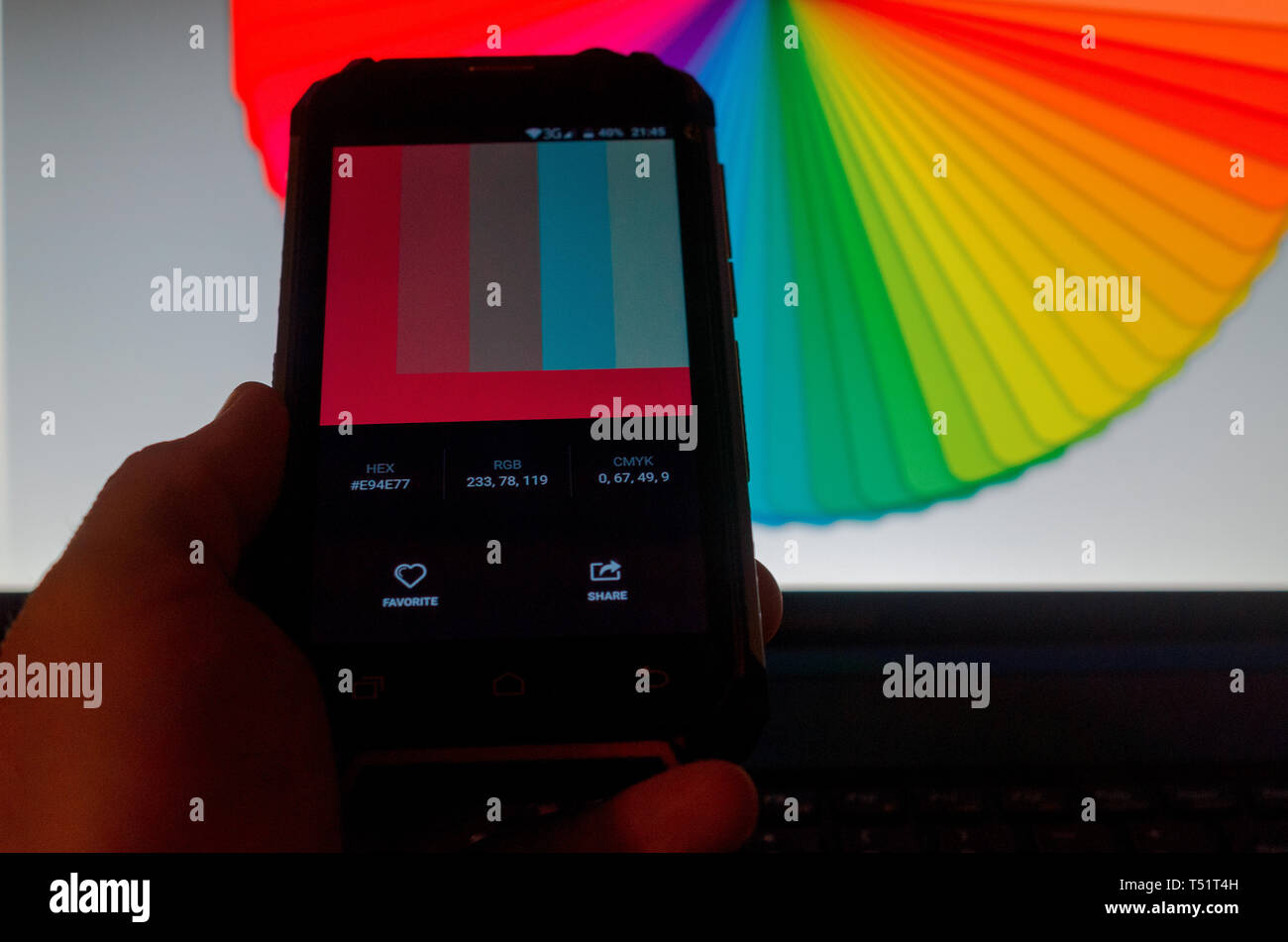 Electronic color palettes between a smartphone and a laptop Stock Photo ...