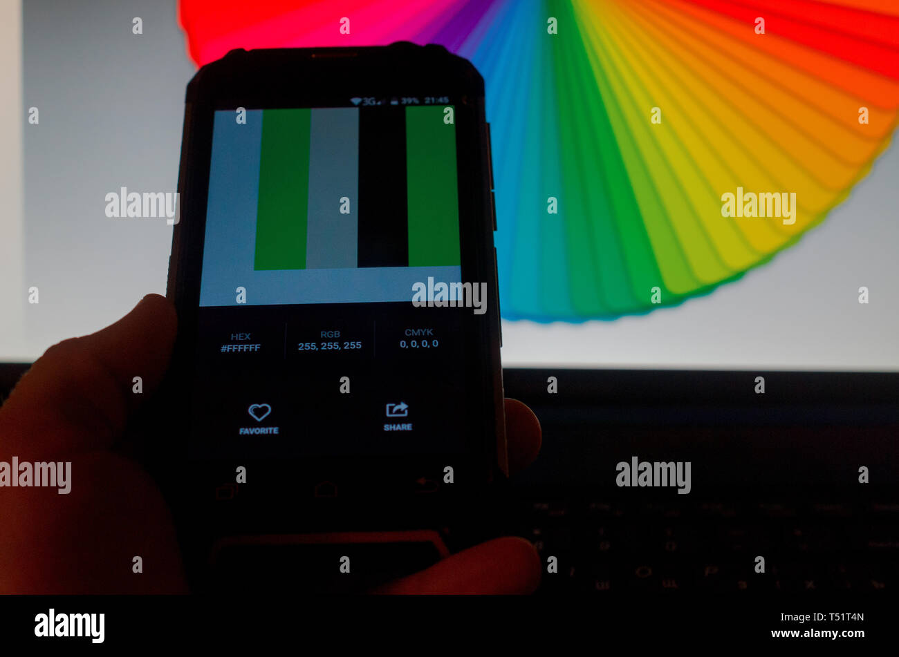 Electronic color palettes between a smartphone and a laptop Stock Photo ...