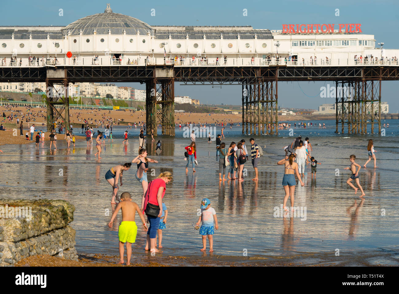 People enjoying the unusually warm spring weather on Brighton beach on ...