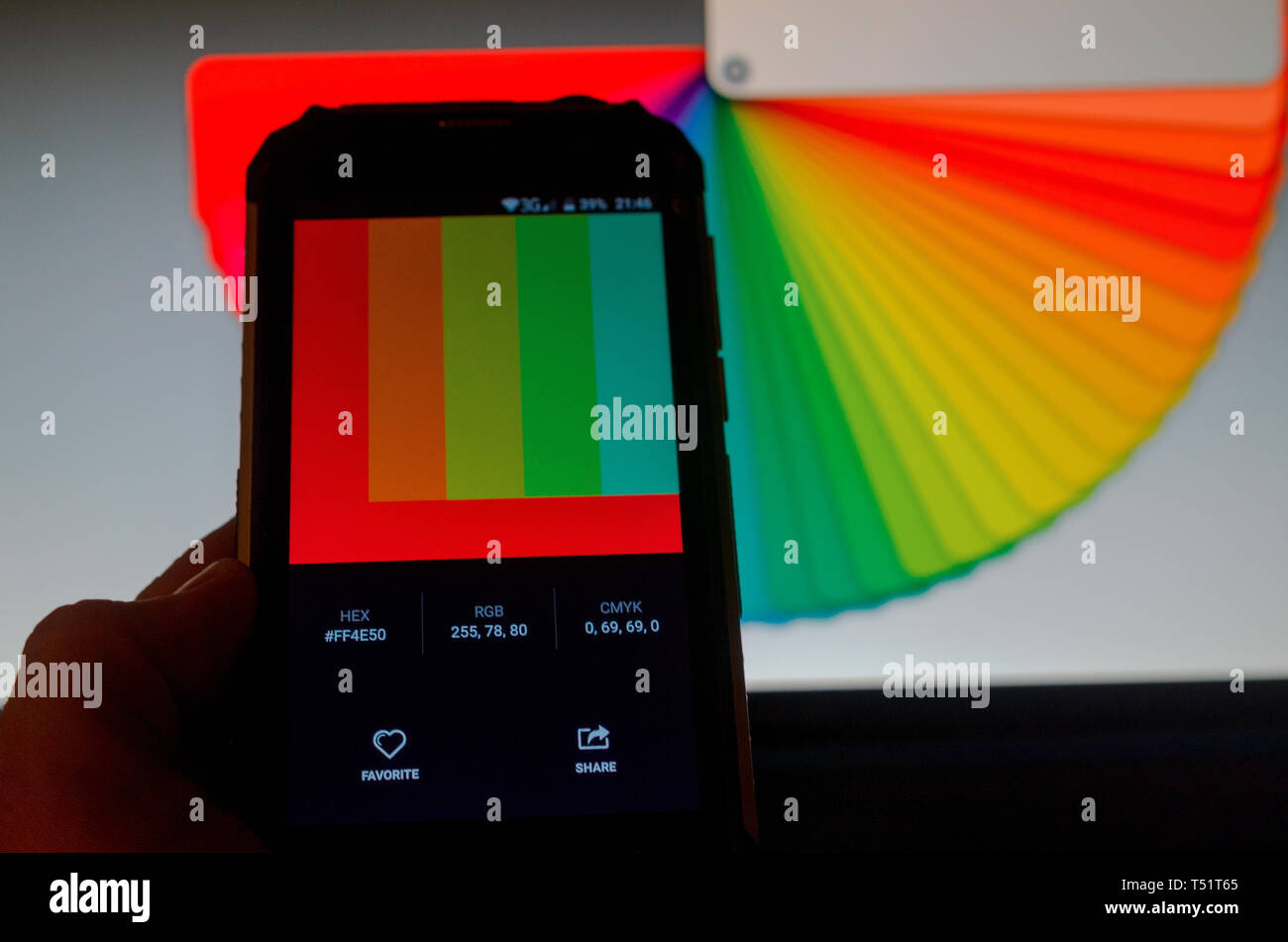 Electronic color palettes between a smartphone and a laptop Stock Photo ...