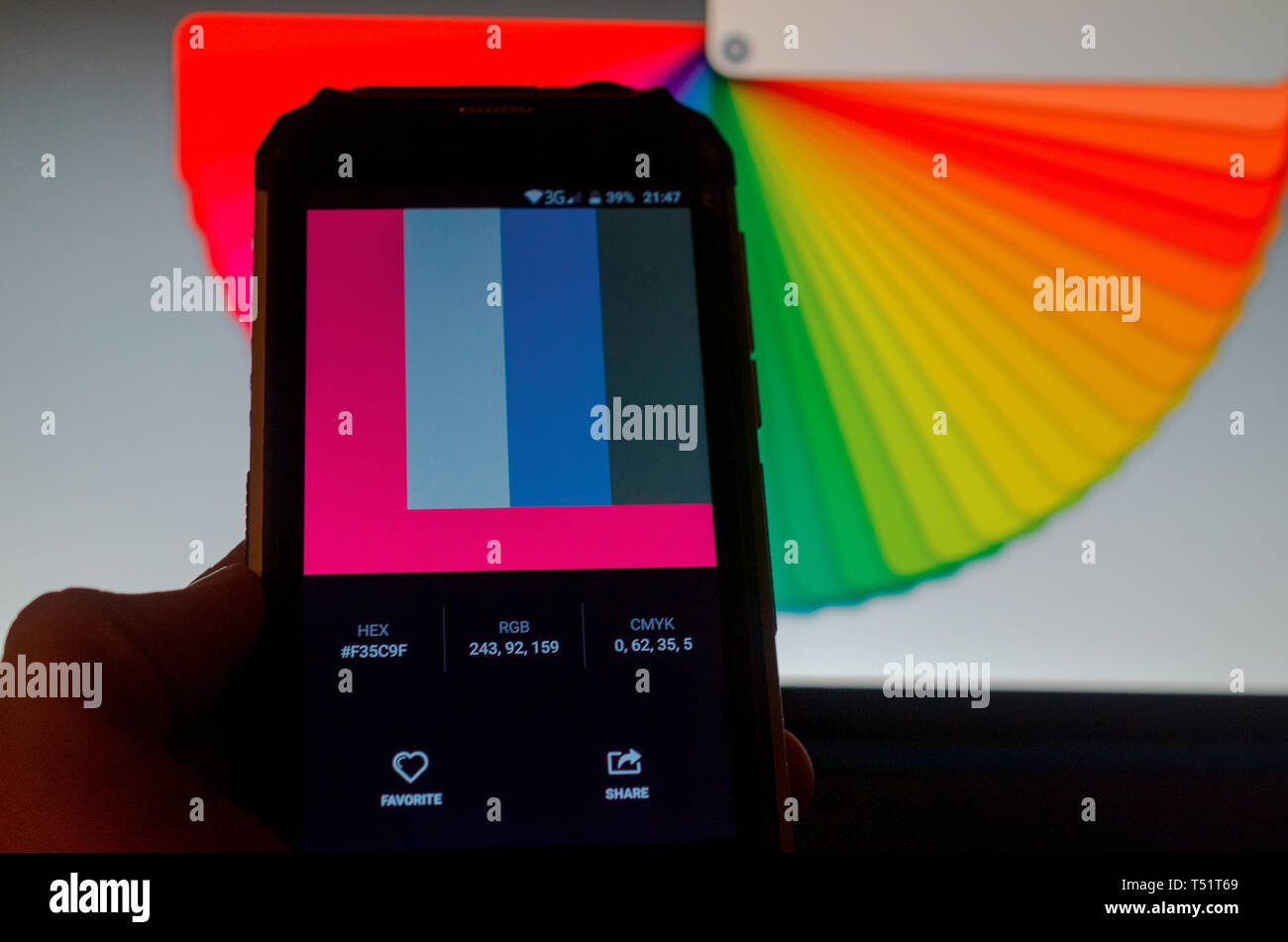 Electronic color palettes between a smartphone and a laptop Stock Photo ...