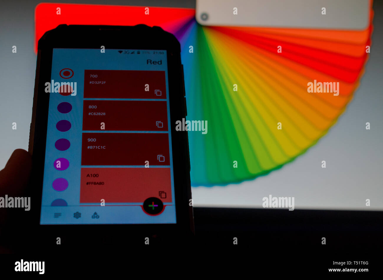Electronic color palettes between a smartphone and a laptop Stock Photo ...