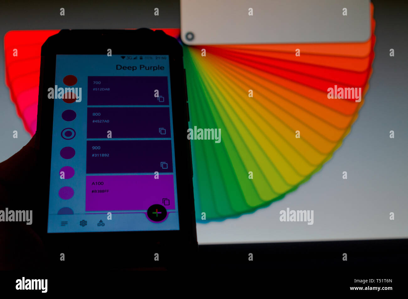 Electronic color palettes between a smartphone and a laptop Stock Photo ...