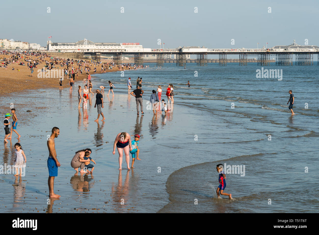 People enjoying the unusually warm spring weather on Brighton beach on ...