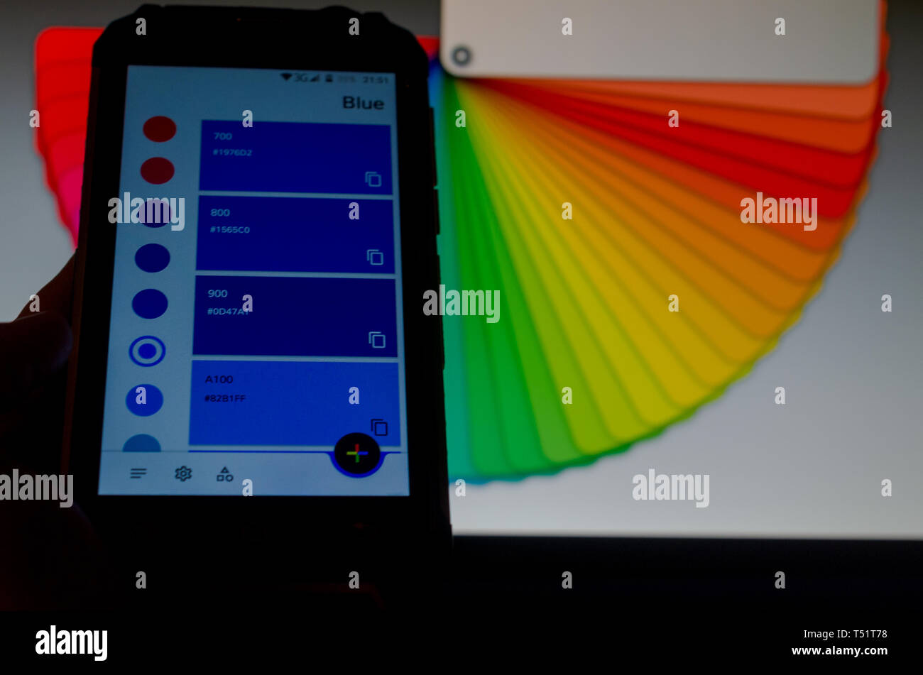 Electronic color palettes between a smartphone and a laptop Stock Photo ...