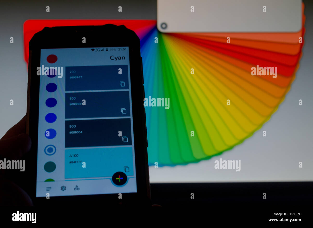Electronic color palettes between a smartphone and a laptop Stock Photo ...