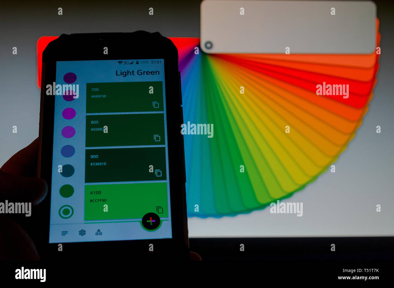 Electronic color palettes between a smartphone and a laptop Stock Photo ...