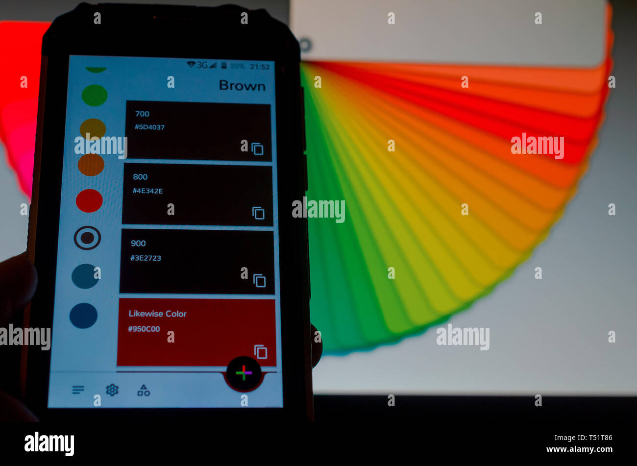 Electronic color palettes between a smartphone and a laptop Stock Photo ...