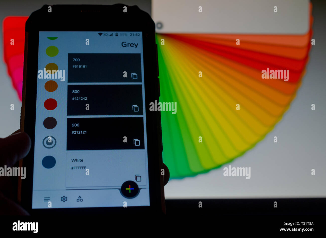 Electronic color palettes between a smartphone and a laptop Stock Photo ...